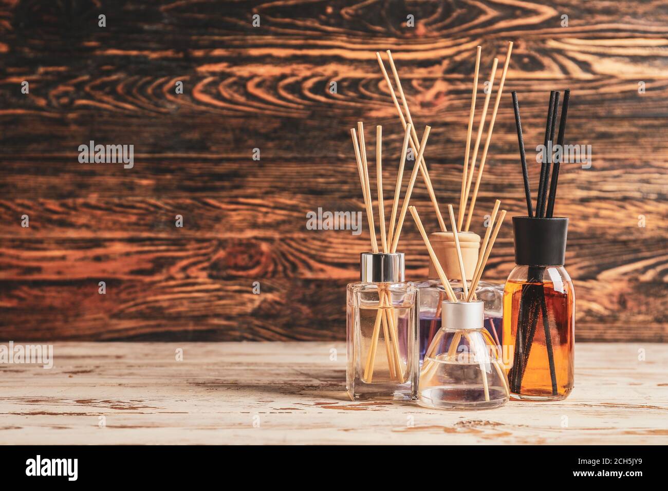 Different reed diffusers on table Stock Photo - Alamy