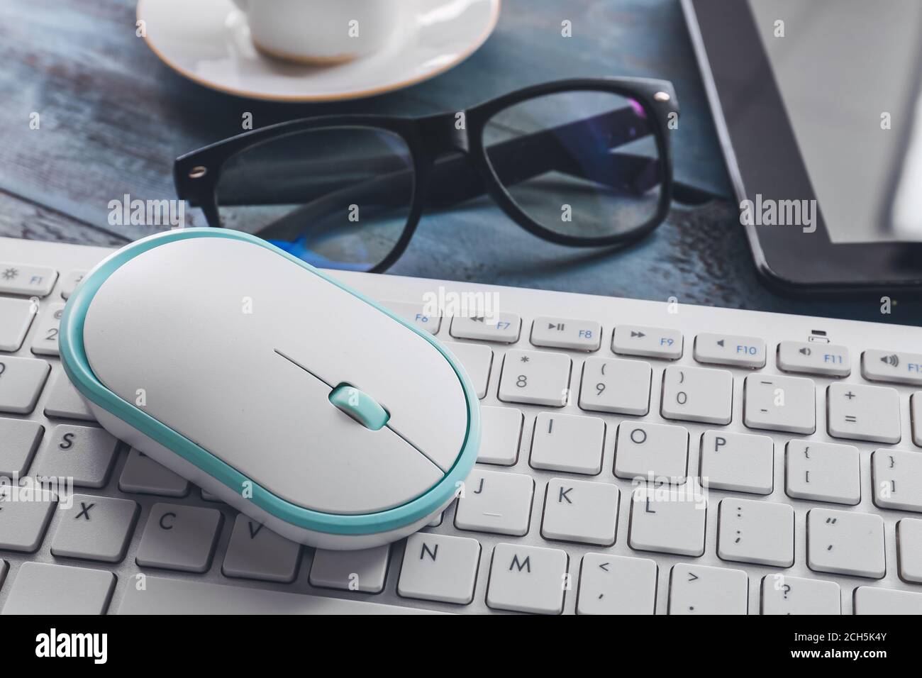 Modern PC mouse and keyboard on table, closeup Stock Photo - Alamy