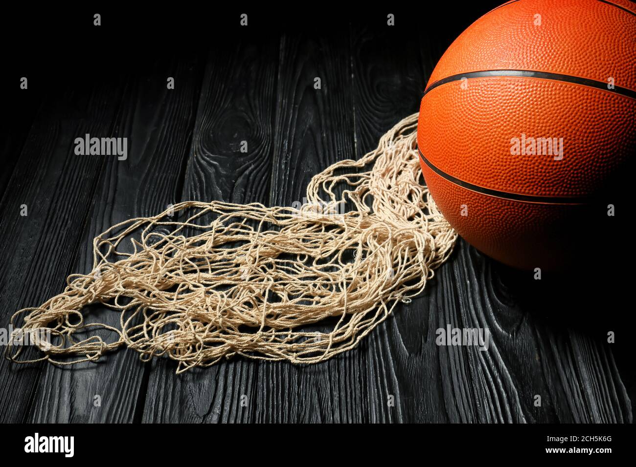Ball for playing basketball and net on table Stock Photo - Alamy