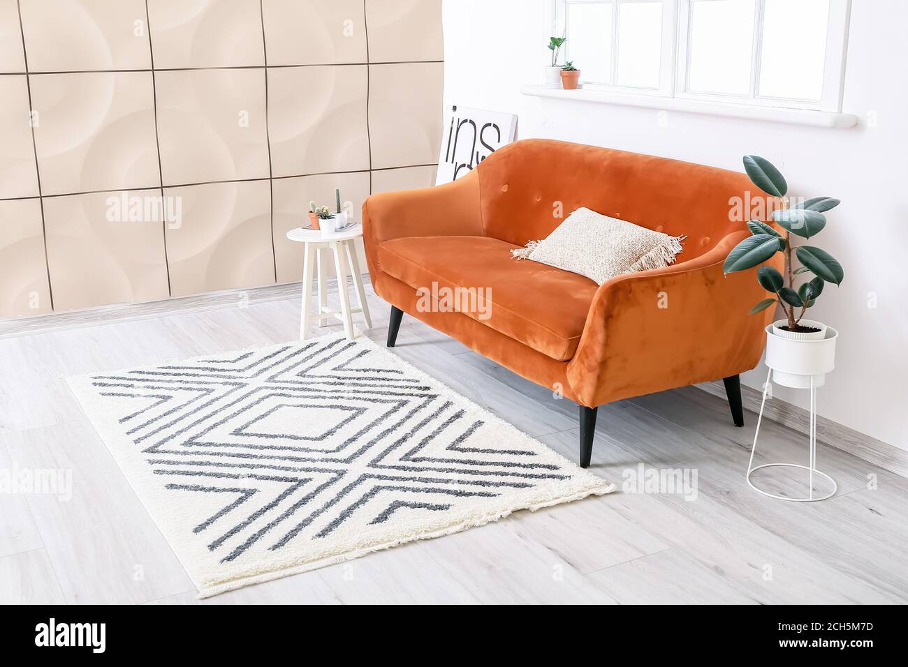 Interior of modern room with sofa and beautiful carpet Stock Photo - Alamy