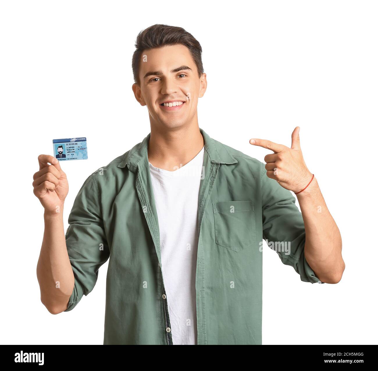 Young man with driving license on white background Stock Photo - Alamy