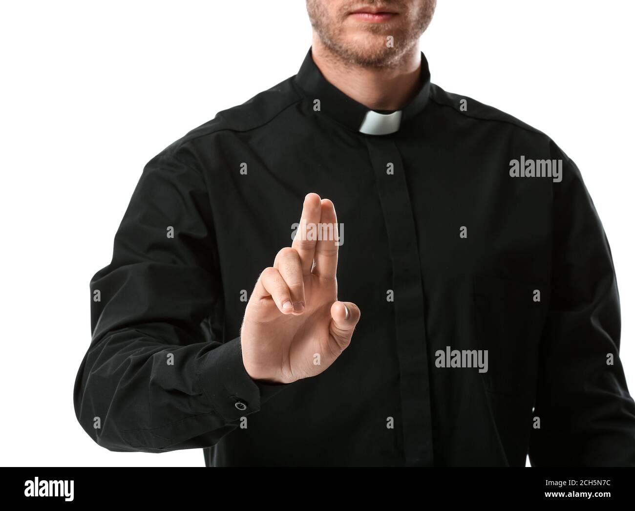 Handsome priest on white background Stock Photo - Alamy