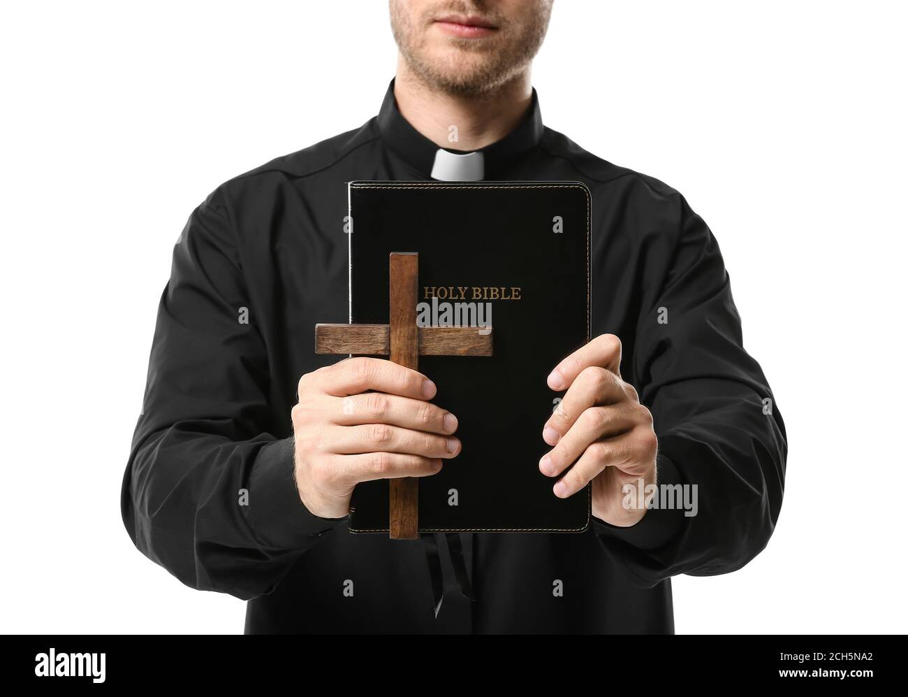 Handsome priest with cross and Bible on white background Stock Photo ...