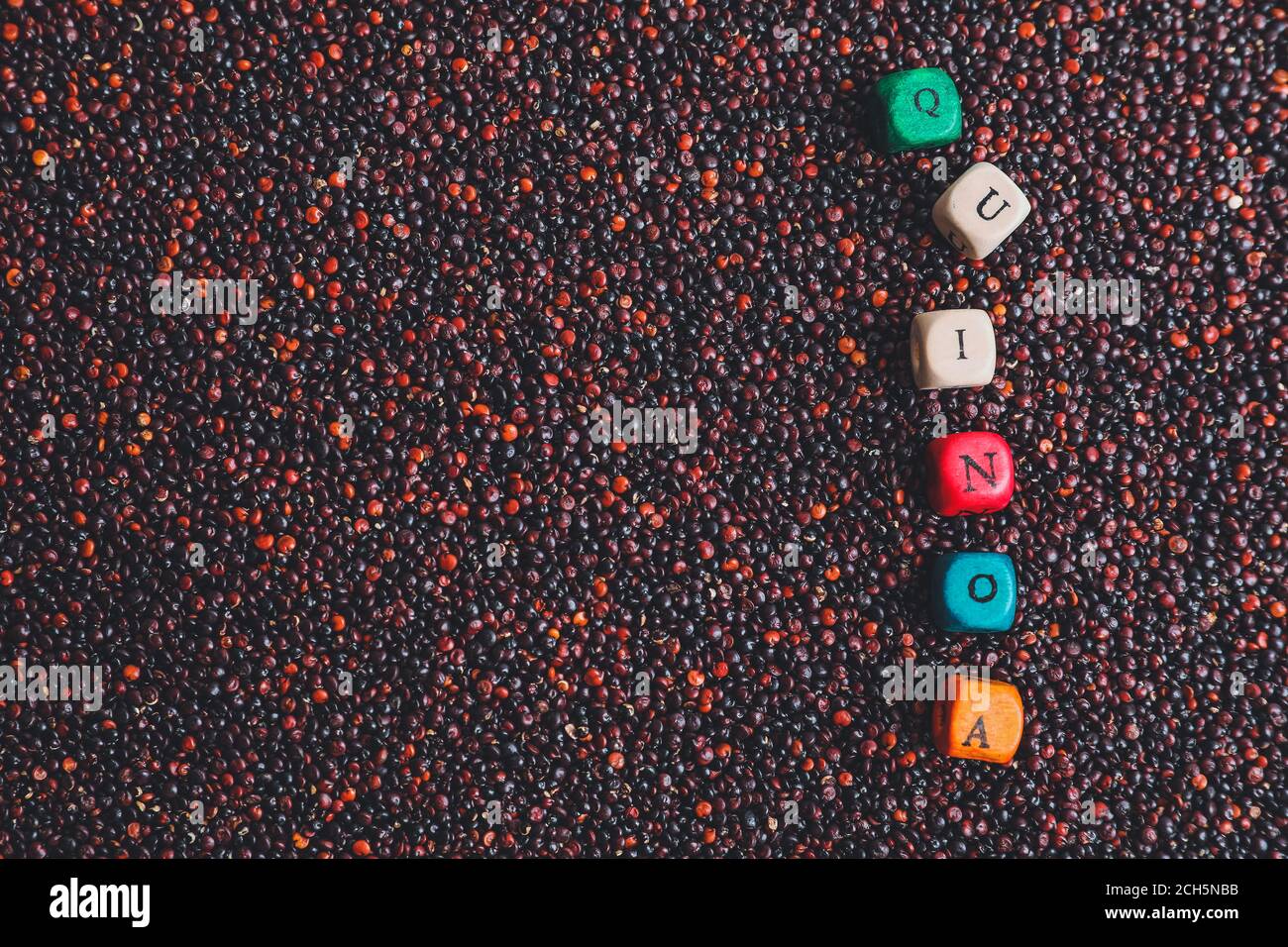 Cubes with word QUINOA and seeds, top view Stock Photo - Alamy