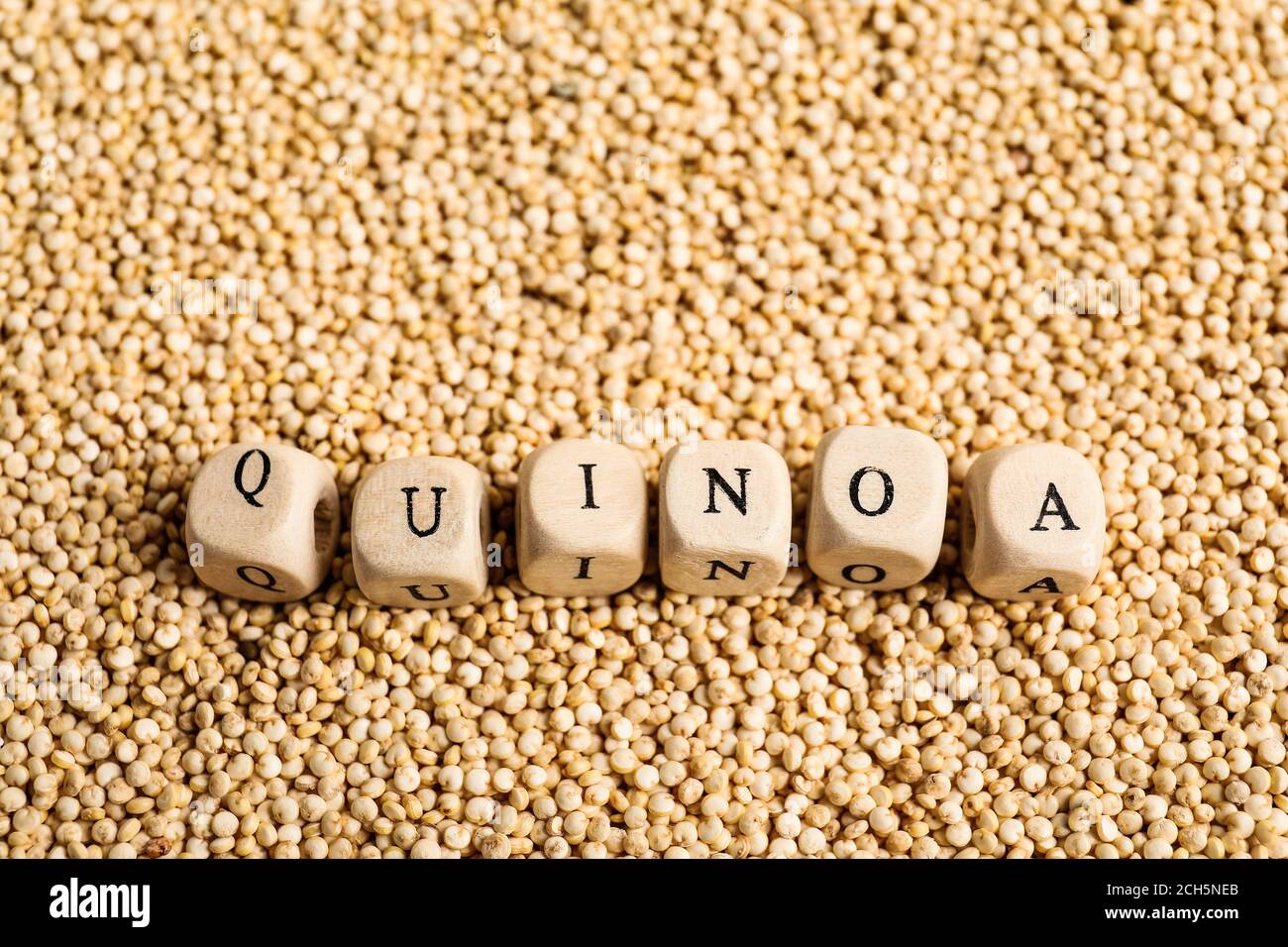 Cubes with word QUINOA on seeds Stock Photo - Alamy