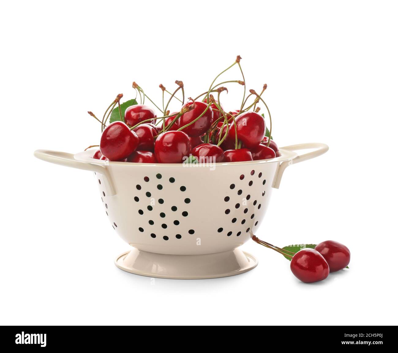 Colander with sweet cherry on white background Stock Photo - Alamy