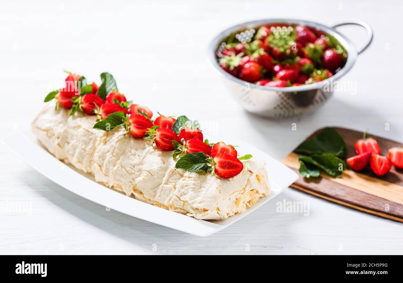 Delicious meringue roll strawberry hi-res stock photography and images ...