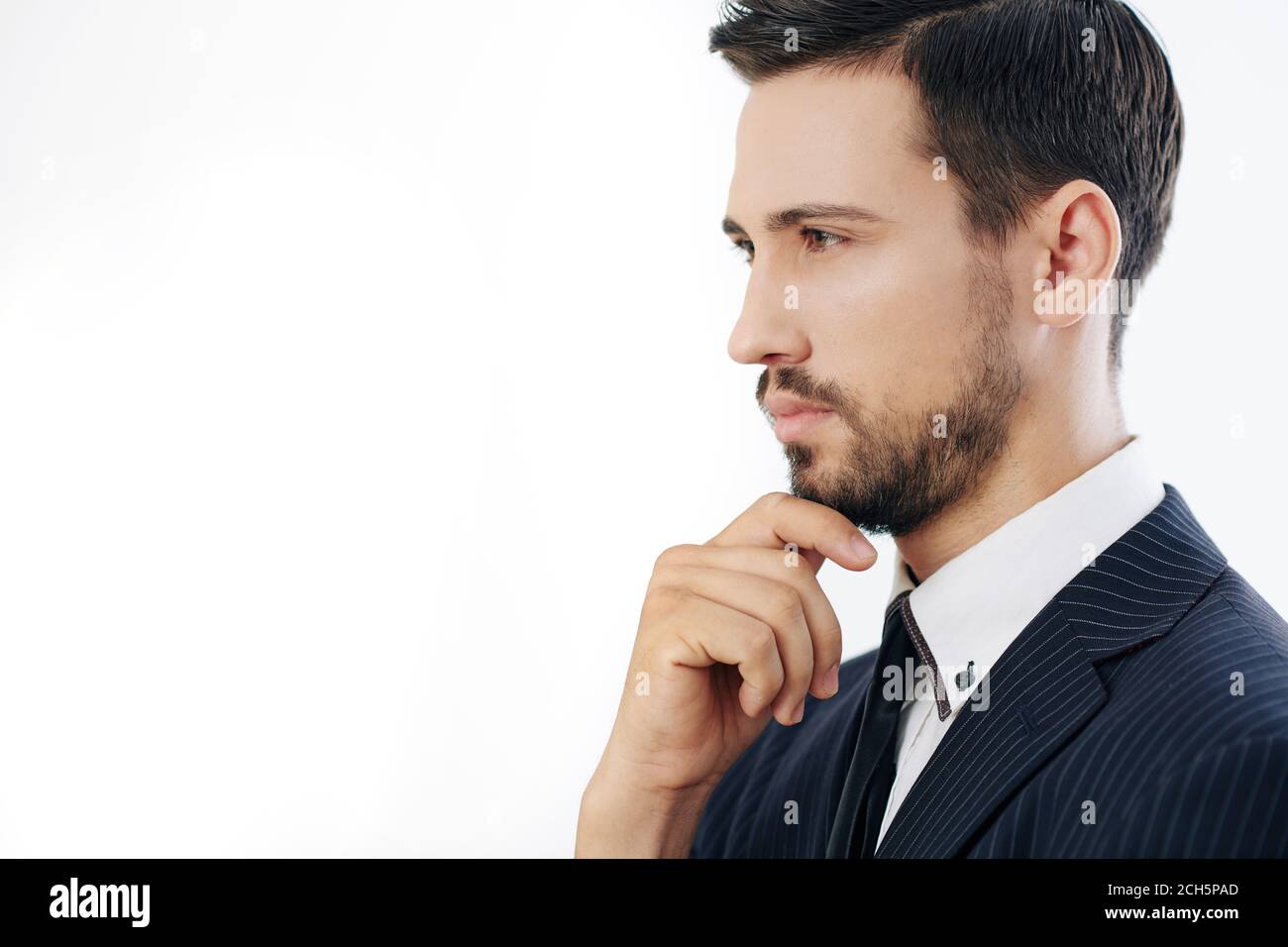 Pensive serious young businessman Stock Photo - Alamy