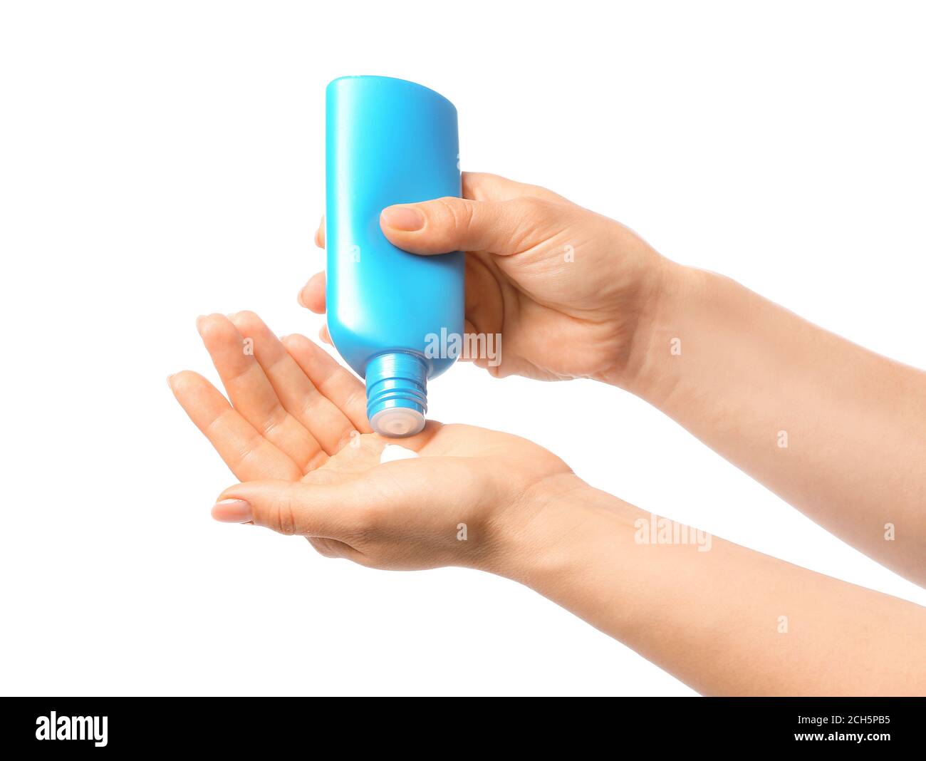 Woman applying sunscreen onto her hand against white background Stock ...