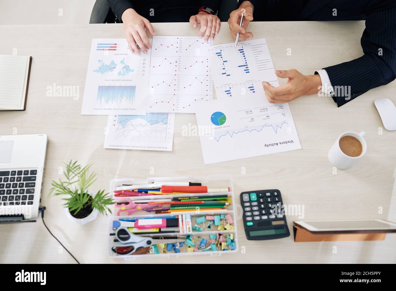 Business people discussing reports Stock Photo - Alamy