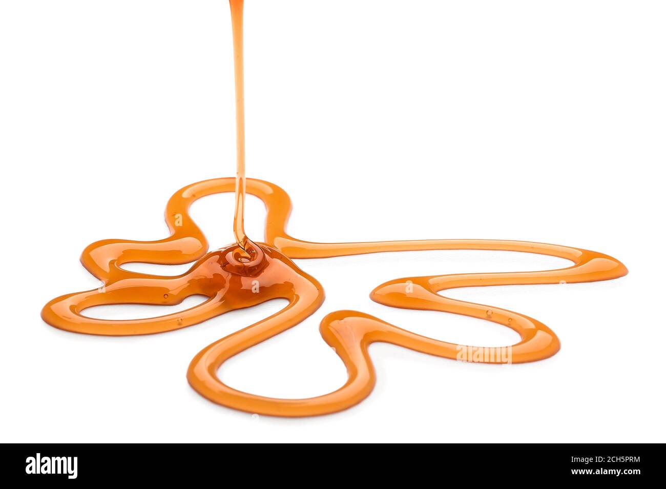 Liquid caramel isolated on white Stock Photo - Alamy