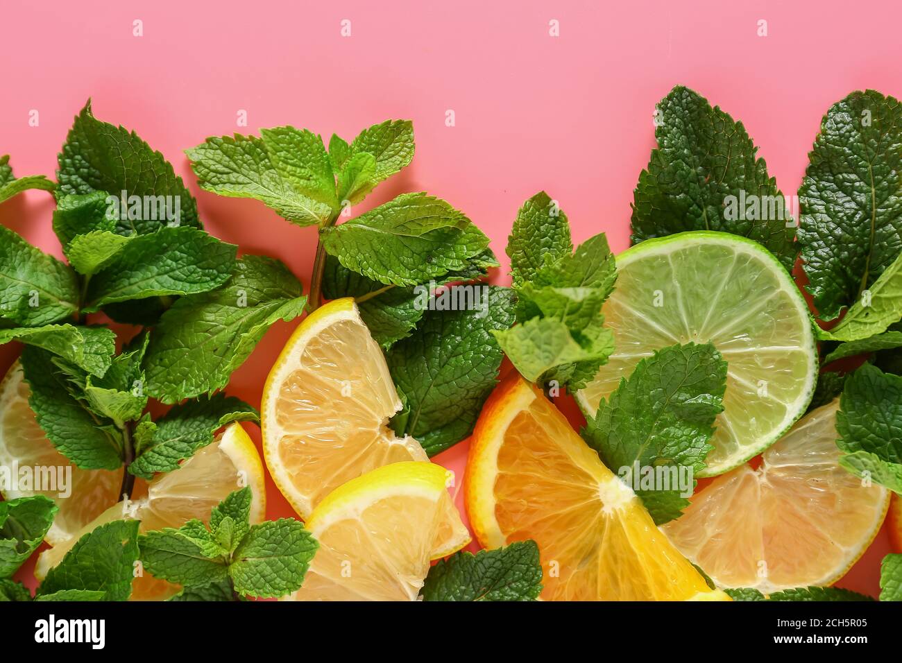 Aromatic mint and citrus fruits on color background Stock Photo - Alamy