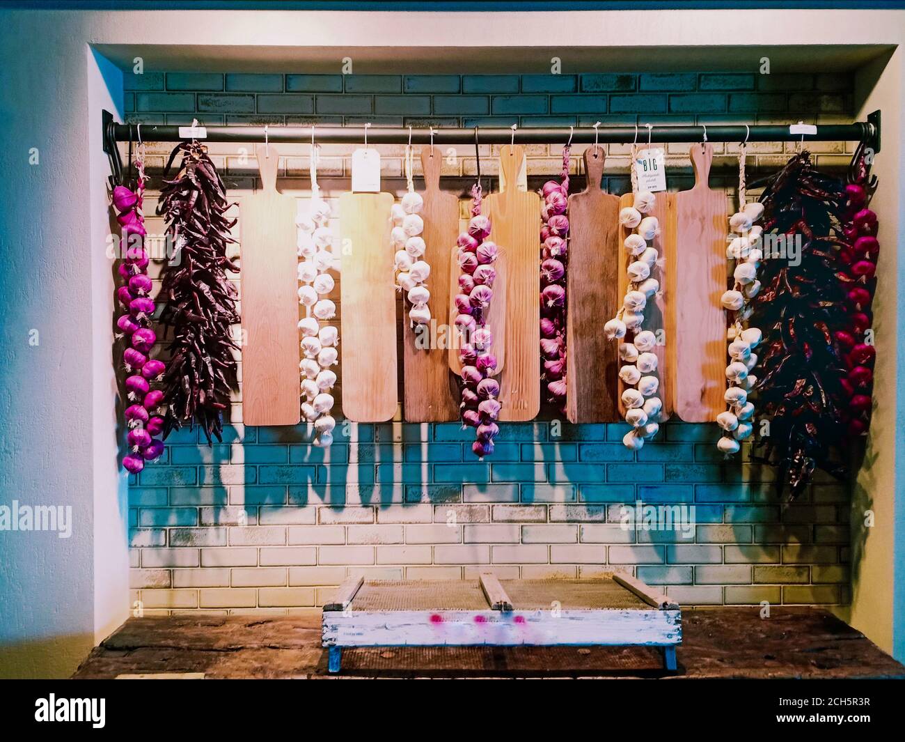 hanging display of onions garlic and red chillies Stock Photo - Alamy