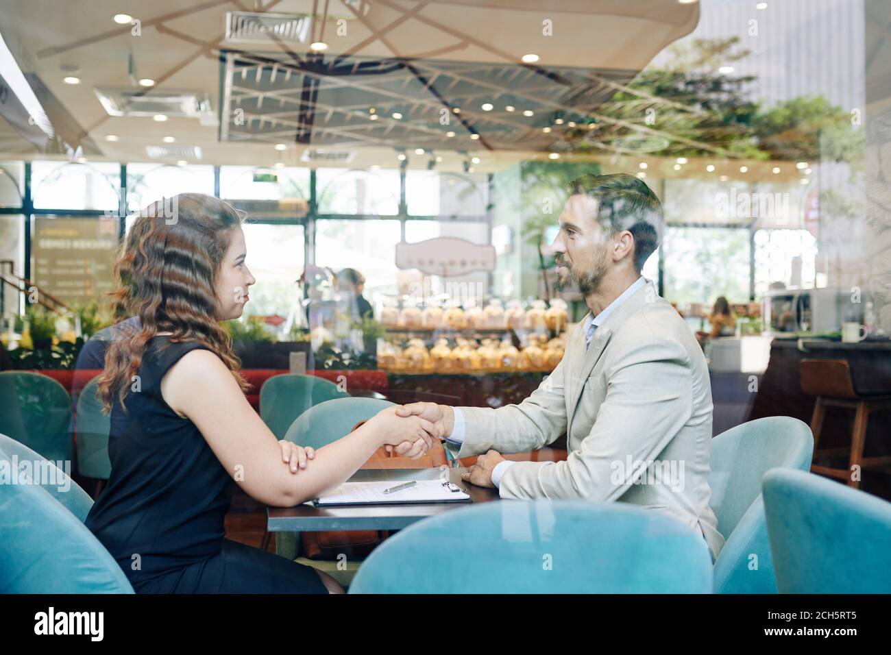 Business partners shaking hands Stock Photo - Alamy