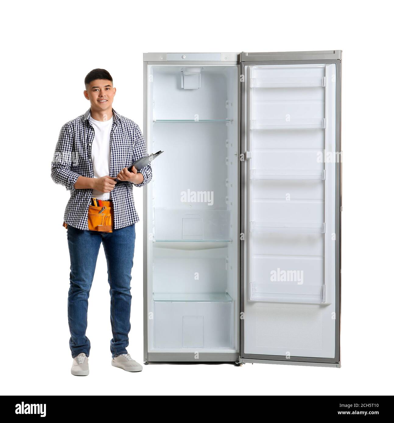 Worker of repair service near fridge on white background Stock Photo ...