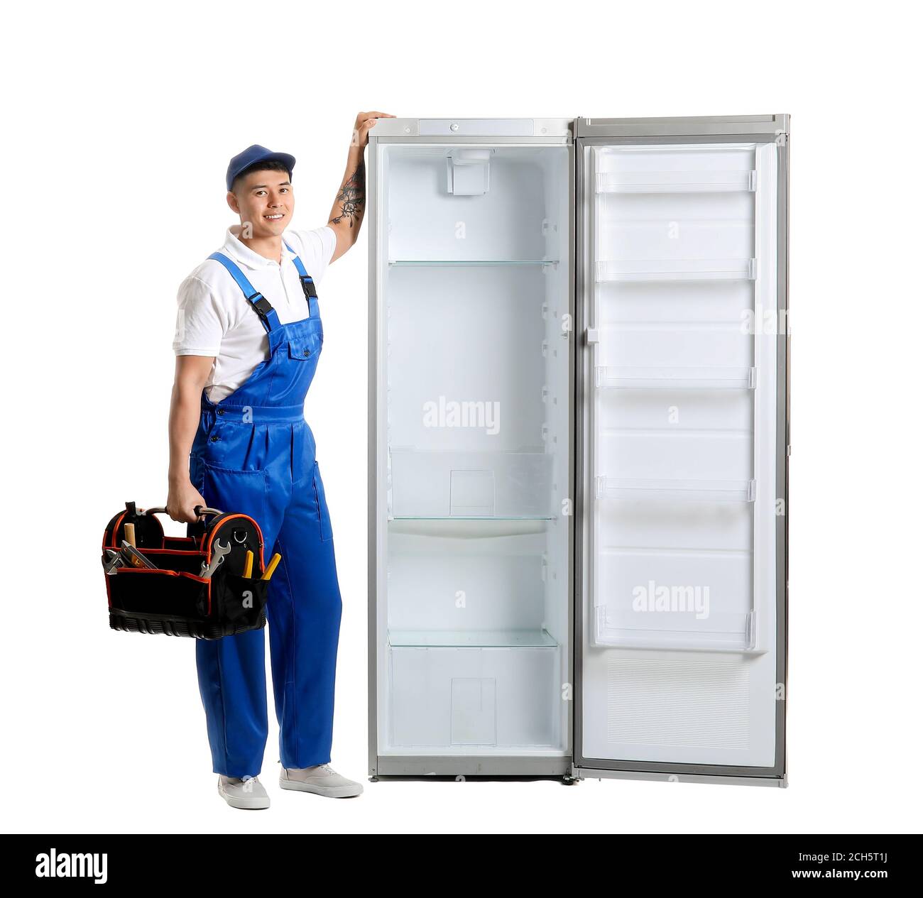 Worker of repair service near fridge on white background Stock Photo ...