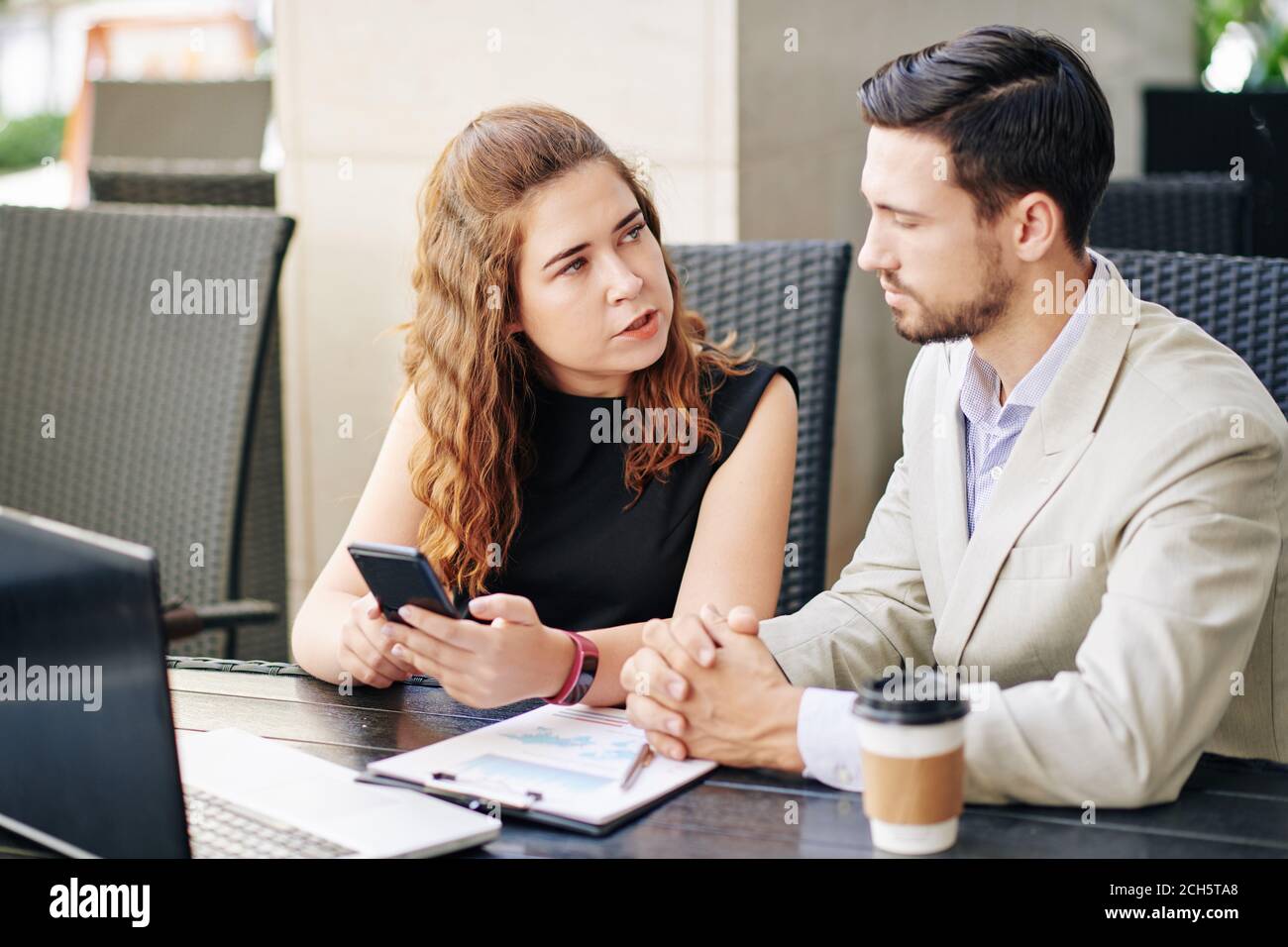 Asking coworker for advice Stock Photo - Alamy