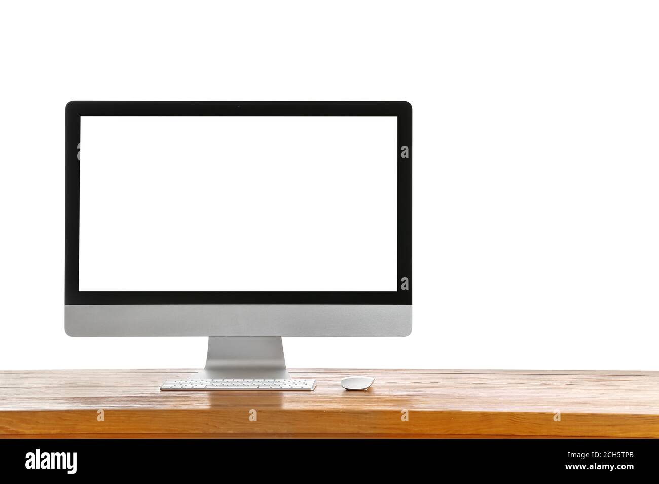 Modern PC monitor on table against white background Stock Photo - Alamy