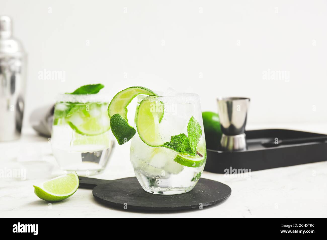 Glasses of fresh mojito on table Stock Photo - Alamy
