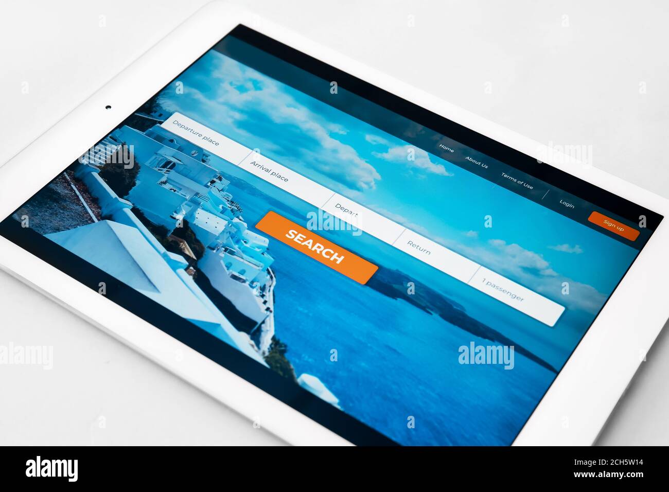 Open page of online booking service on screen of tablet computer on ...