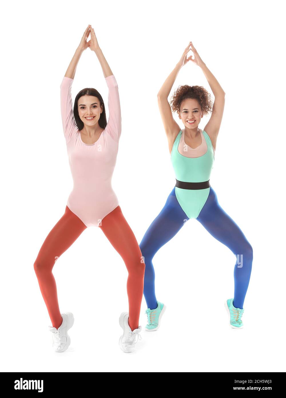 Young women doing aerobics on white background Stock Photo - Alamy
