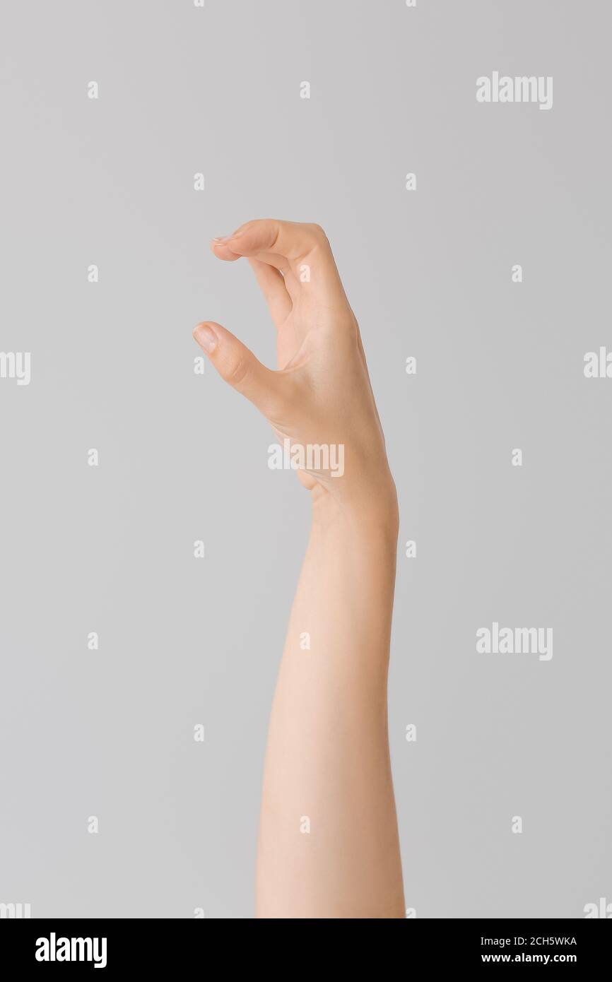 Hand showing letter C on grey background. Sign language alphabet Stock ...