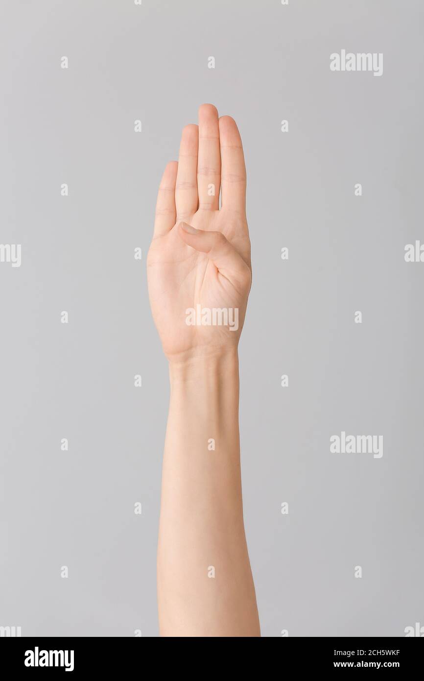 Hand showing letter B on grey background. Sign language alphabet Stock ...