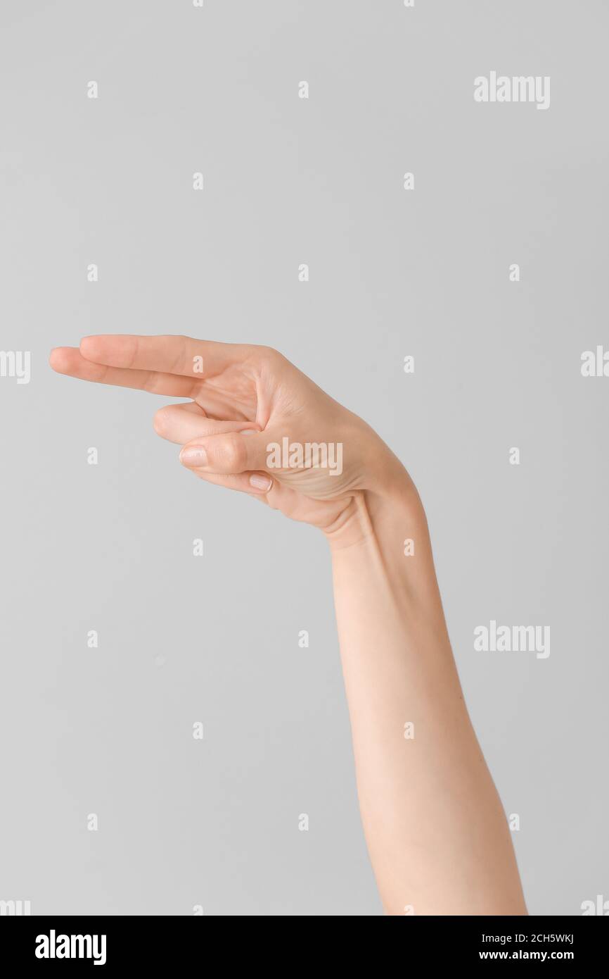 Hand showing letter H on grey background. Sign language alphabet Stock ...