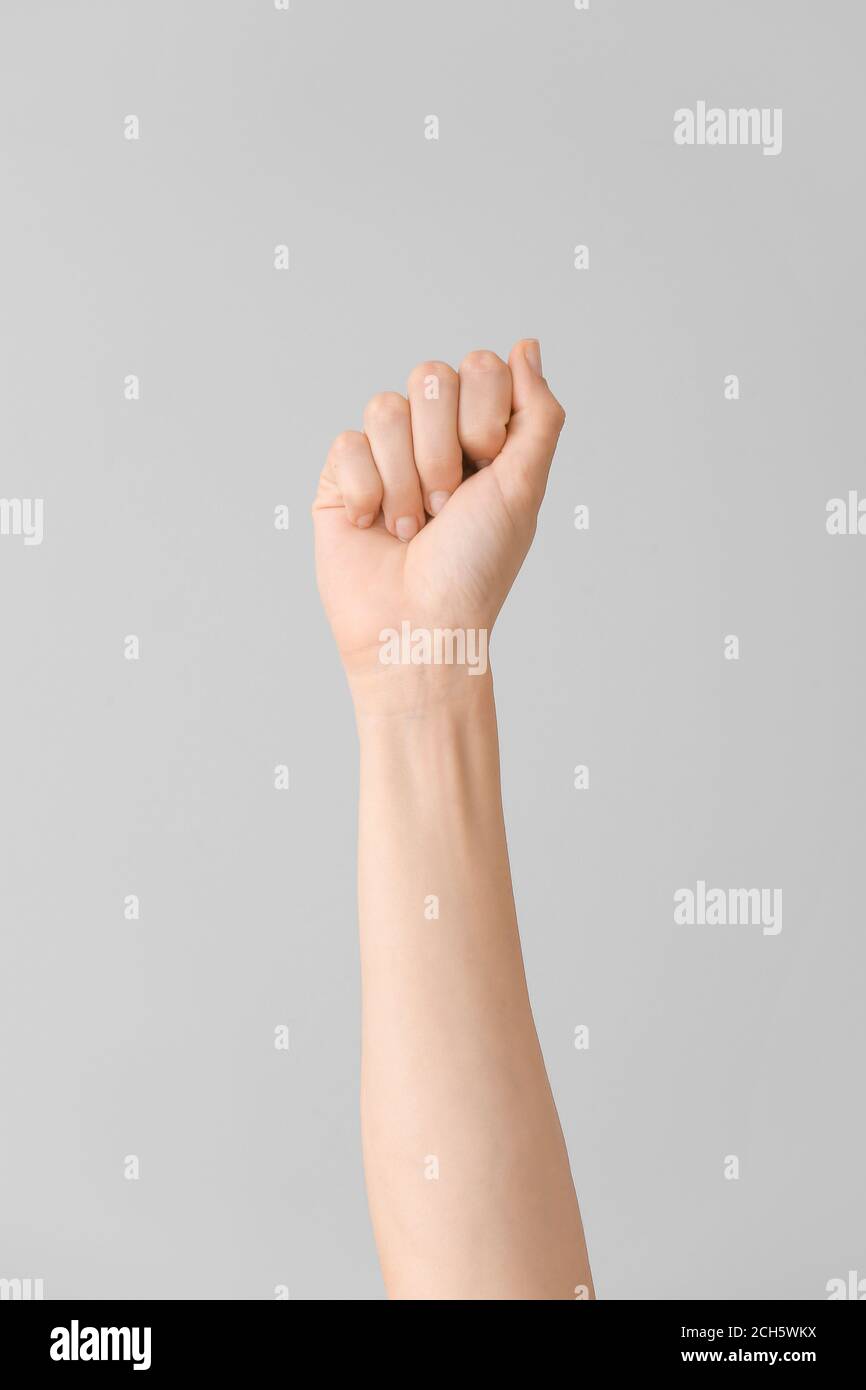Hand showing letter A on grey background. Sign language alphabet Stock ...
