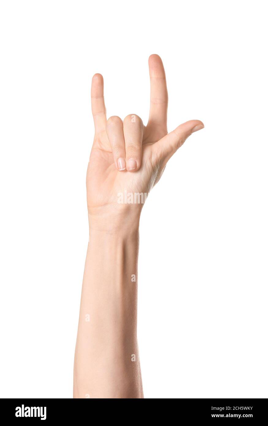 Hand of woman showing "devil horns" gesture on white background Stock ...