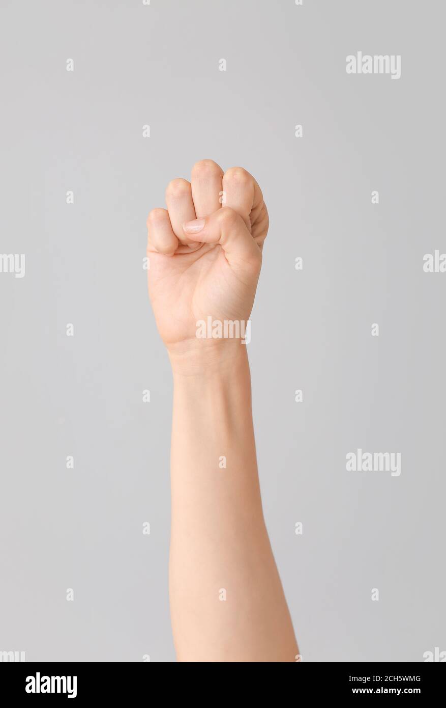 Hand showing letter S on grey background. Sign language alphabet Stock ...