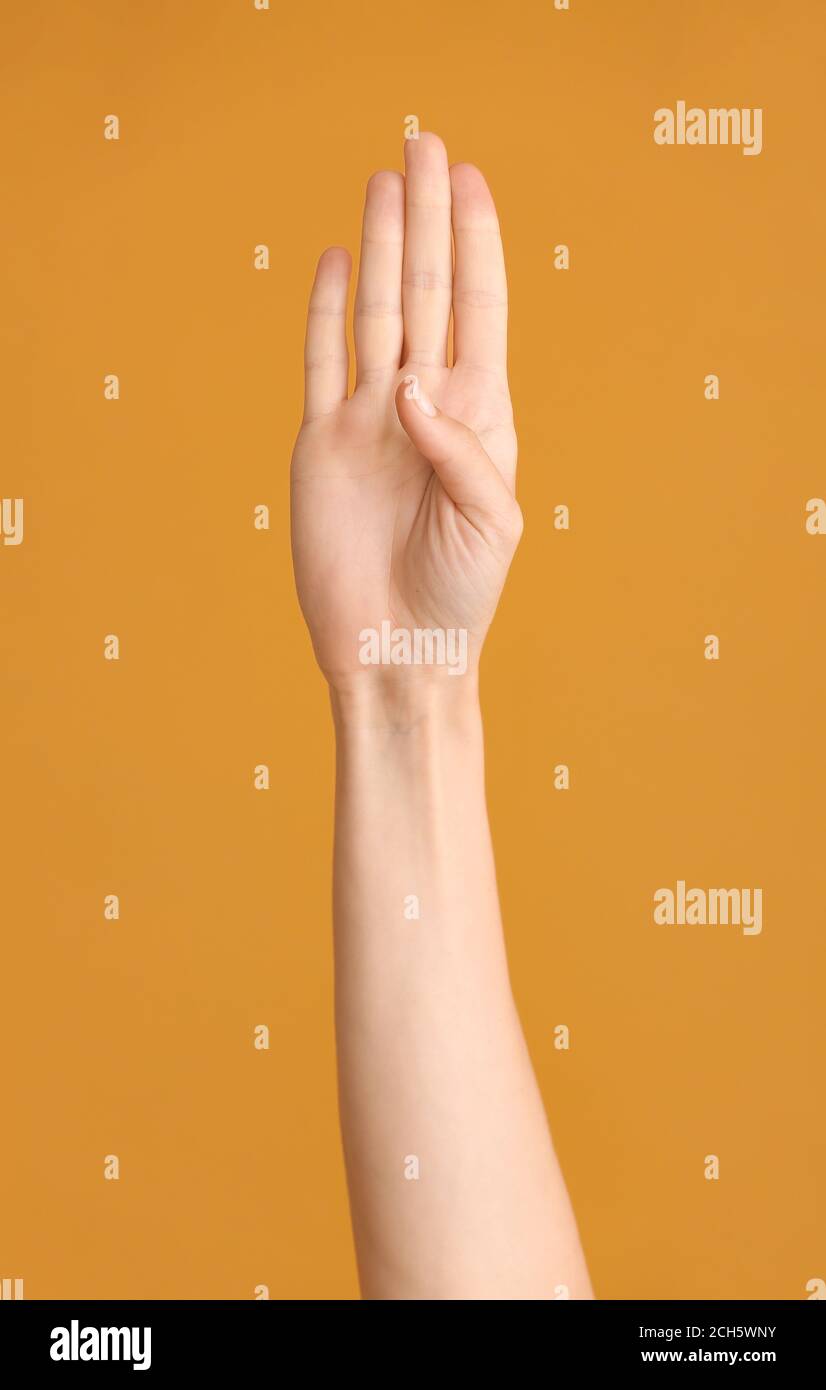 Hand showing letter B on color background. Sign language alphabet Stock ...