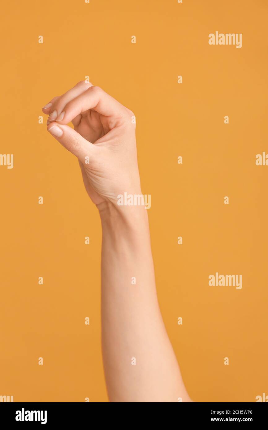 Hand showing letter O on color background. Sign language alphabet Stock ...