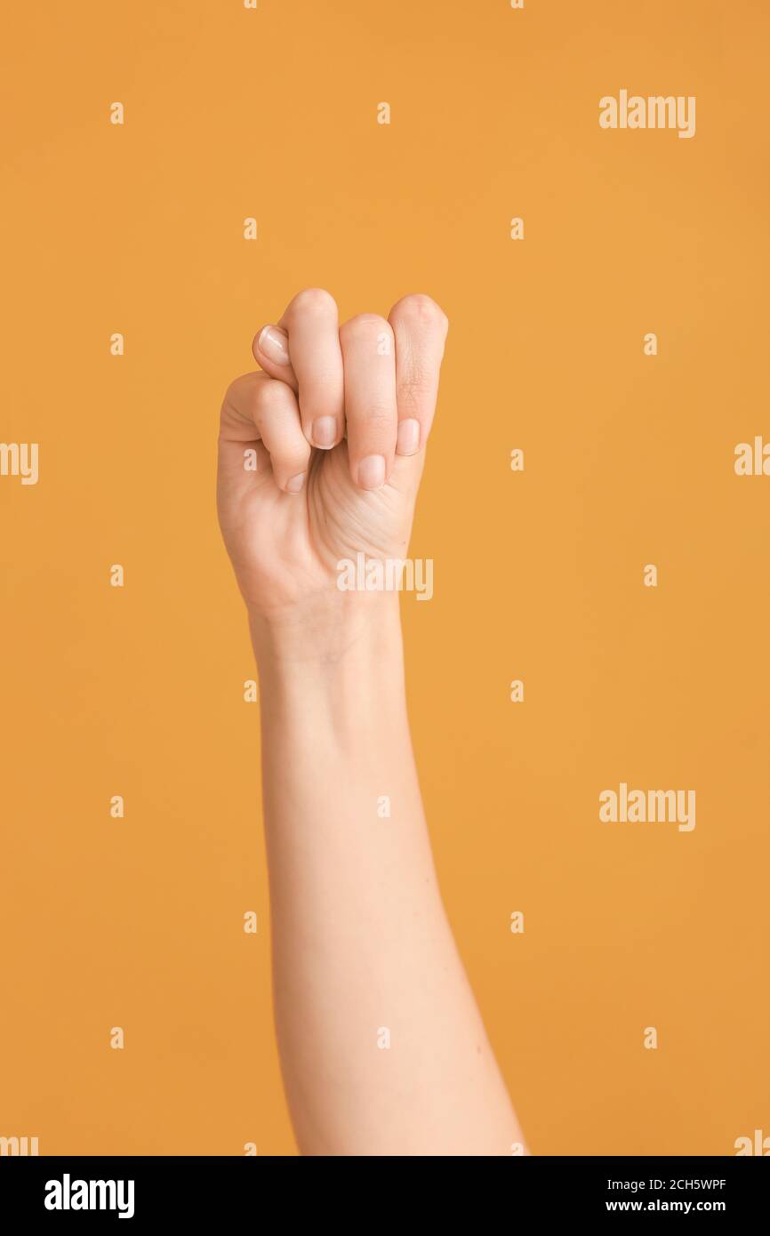 Hand showing letter M on color background. Sign language alphabet Stock ...