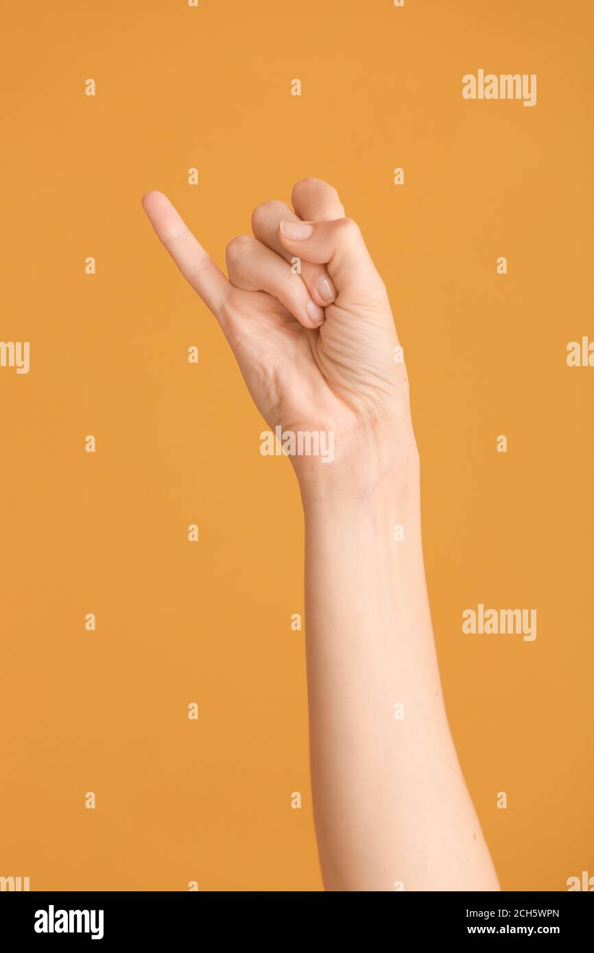 Hand showing letter J on color background. Sign language alphabet Stock ...