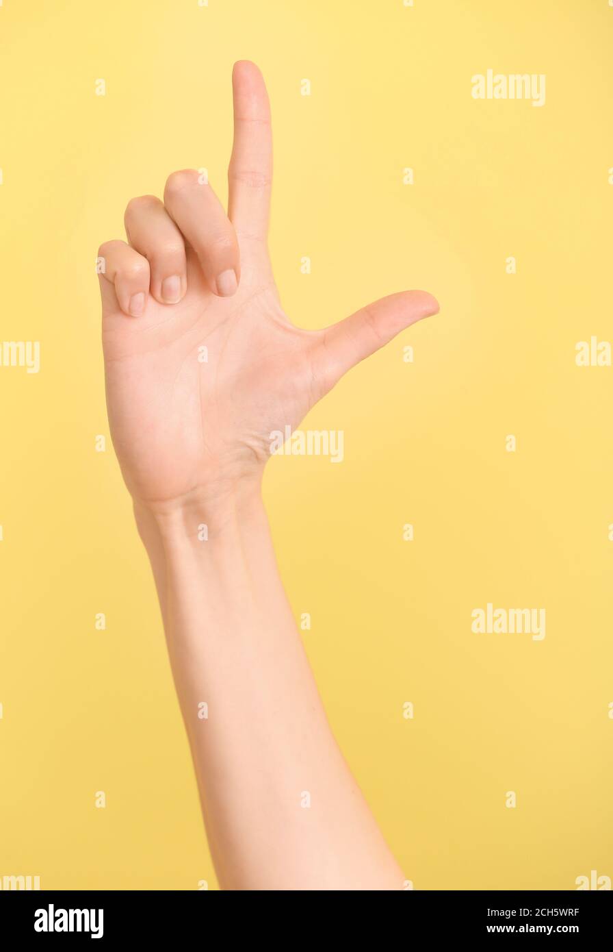 Hand showing letter L on color background. Sign language alphabet Stock ...