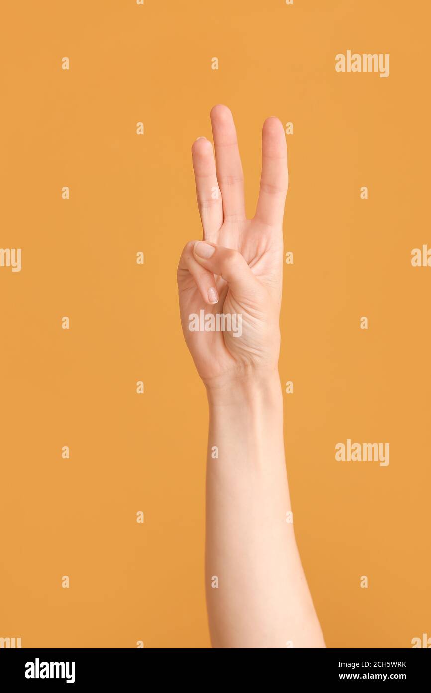 Hand showing letter W on color background. Sign language alphabet Stock ...