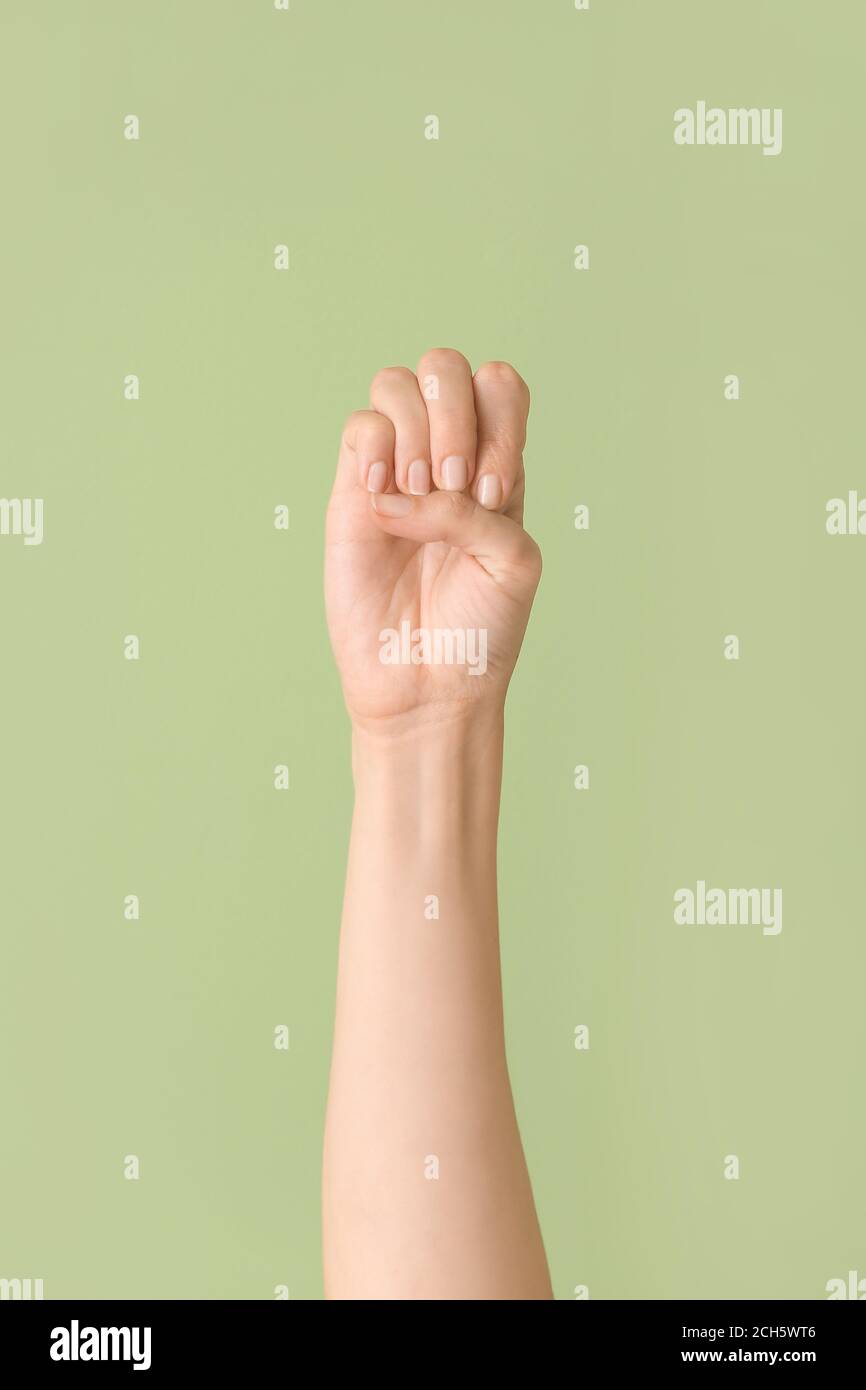 Hand showing letter E on color background. Sign language alphabet Stock ...