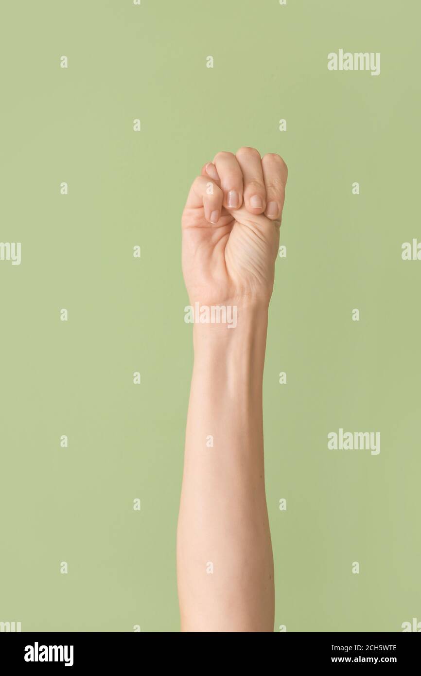Hand showing letter M on color background. Sign language alphabet Stock ...
