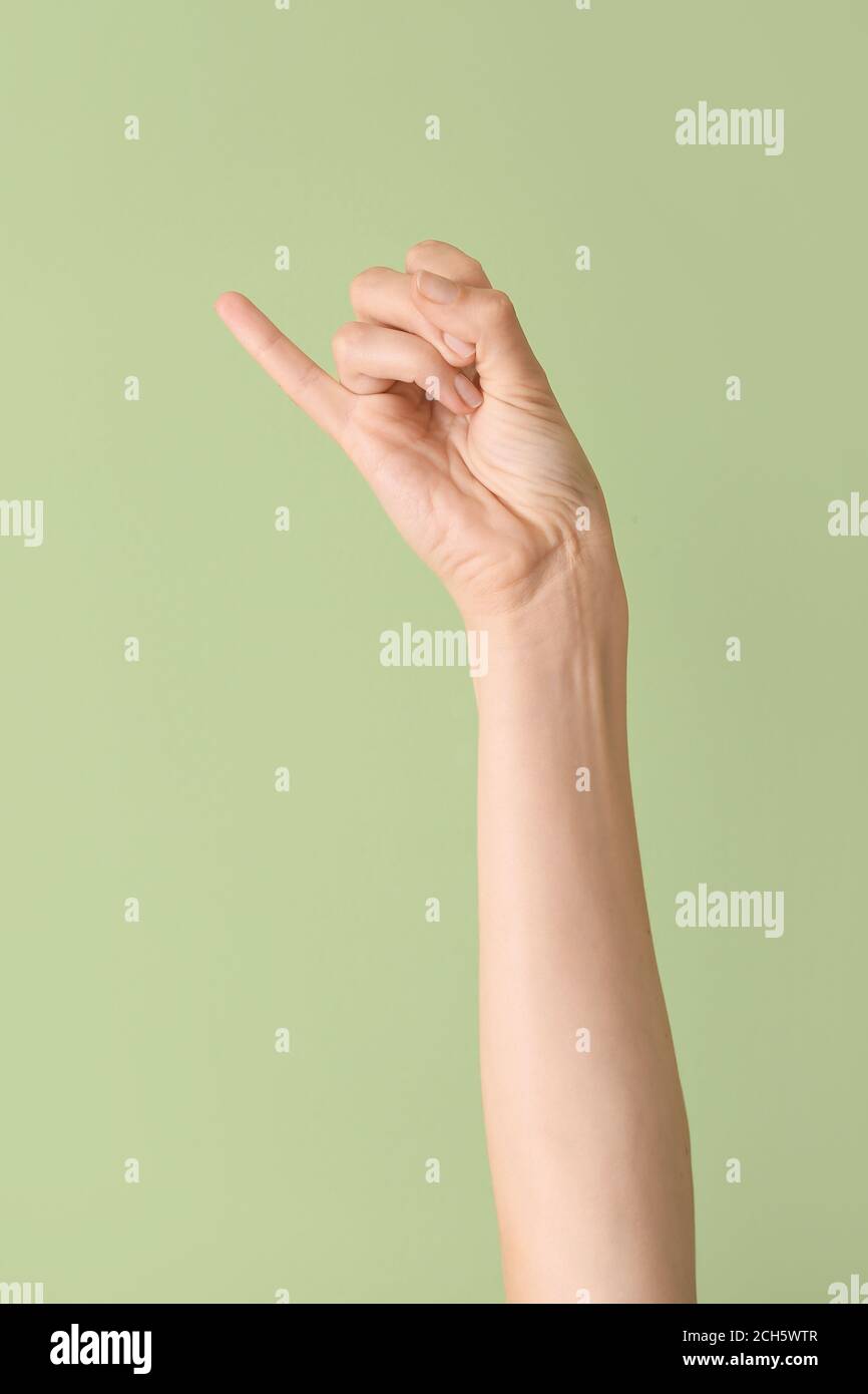 Hand showing letter J on color background. Sign language alphabet Stock ...