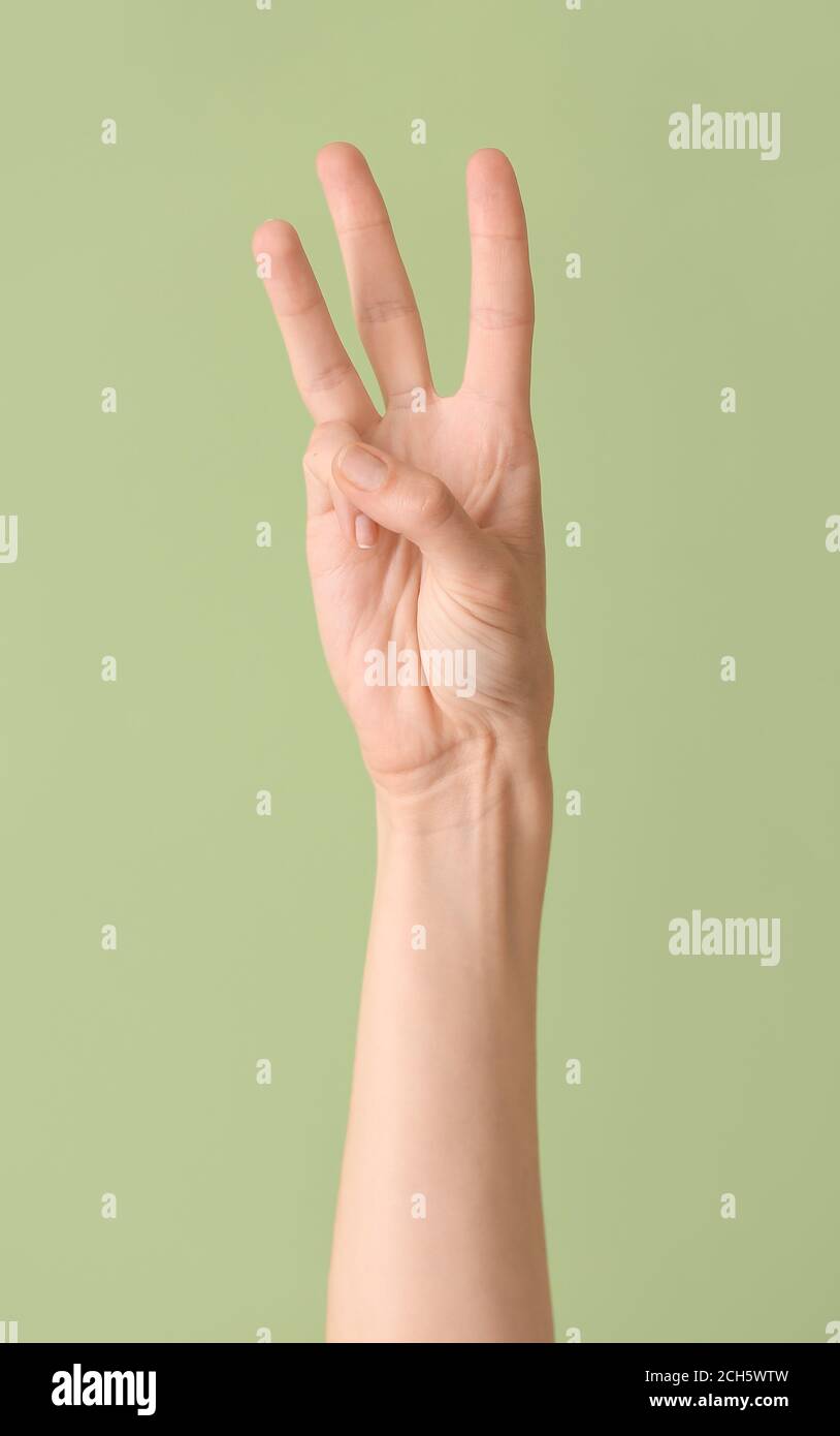 Hand showing letter W on color background. Sign language alphabet Stock ...