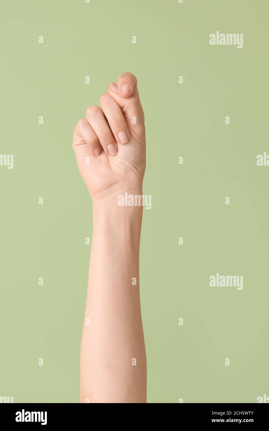Hand showing letter T on color background. Sign language alphabet Stock ...