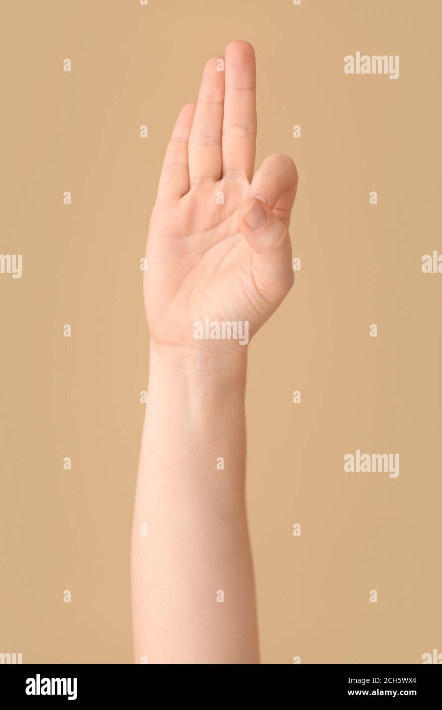 Hand showing letter F on color background. Sign language alphabet Stock ...