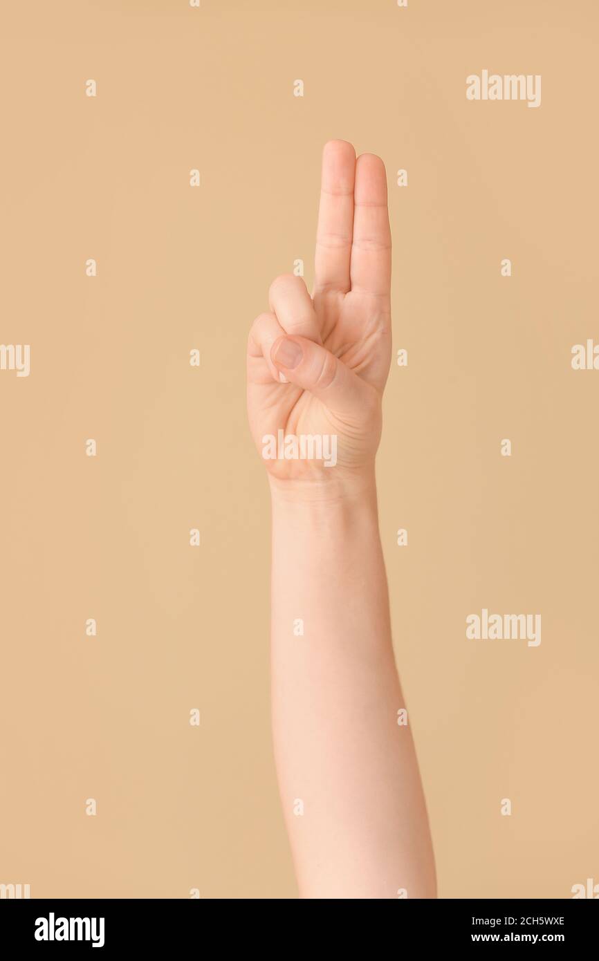 Hand showing letter U on color background. Sign language alphabet Stock ...