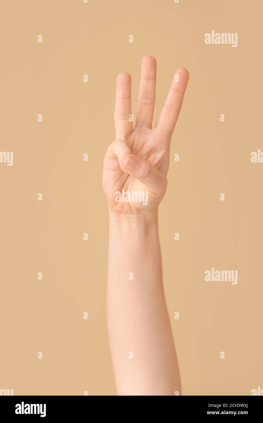 Hand showing letter W on color background. Sign language alphabet Stock ...