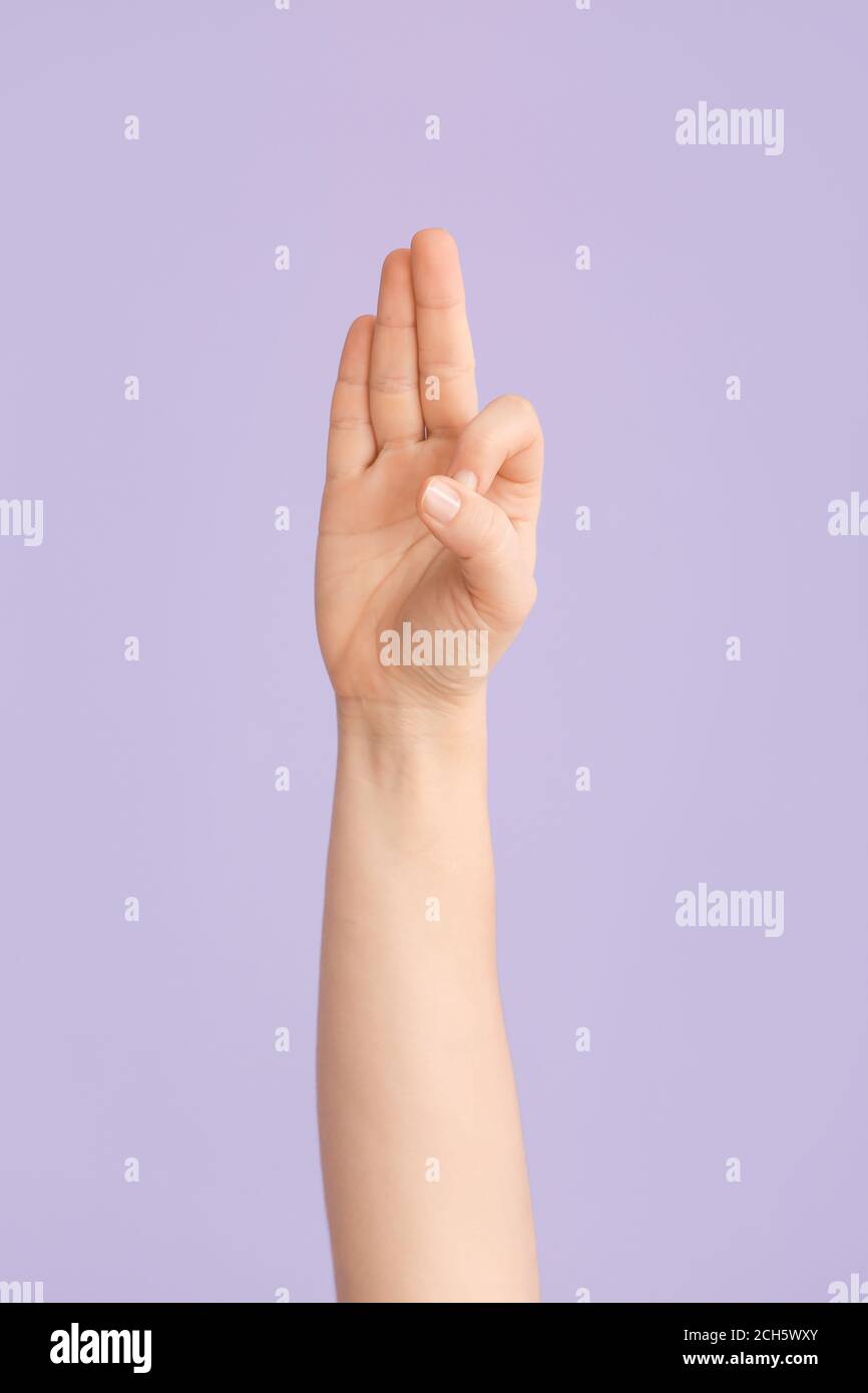 Hand showing letter F on color background. Sign language alphabet Stock ...