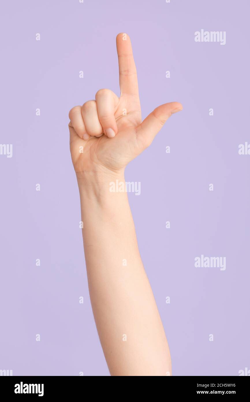 Hand showing letter L on color background. Sign language alphabet Stock ...