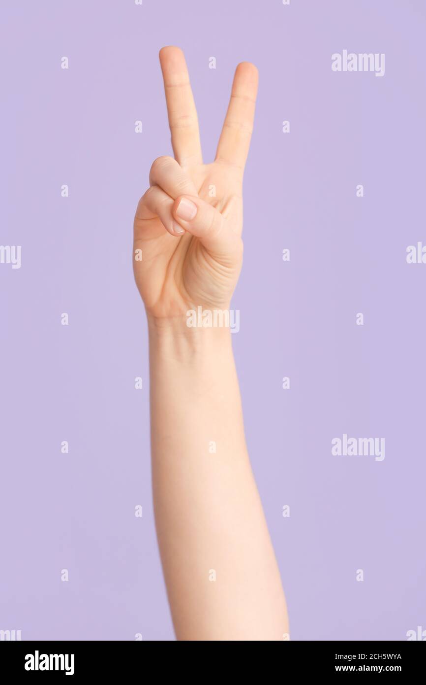 Hand showing letter V on color background. Sign language alphabet Stock ...
