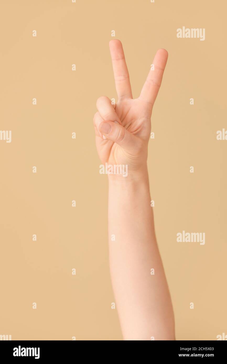Hand showing letter V on color background. Sign language alphabet Stock ...