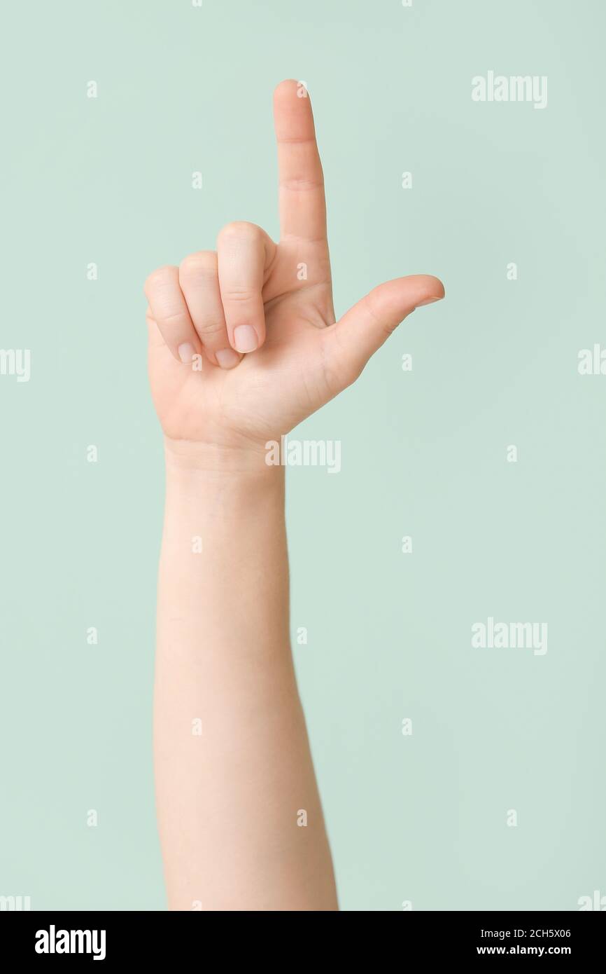 Hand showing letter L on color background. Sign language alphabet Stock ...
